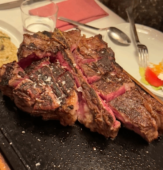T-bone steak by Victoria Kelly | WanderBoat AI Trip Planner